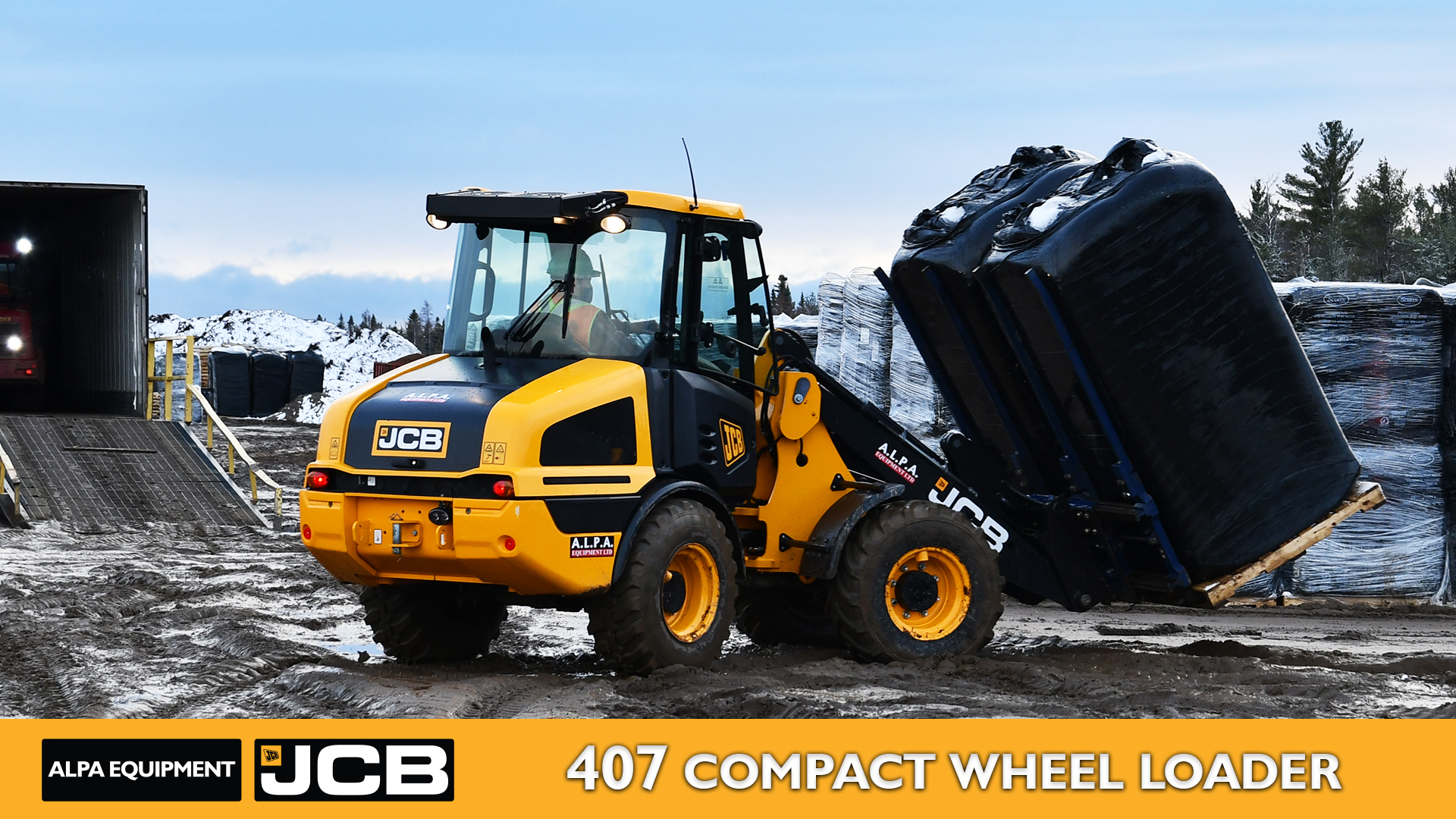 JCB 407 Compact Loader loading pallets of peat moss, with fork ...